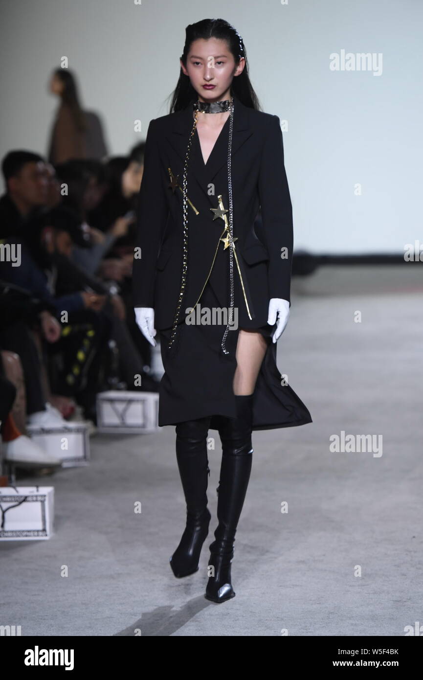 A model displays a new creation at the fashion show of Chris by ...