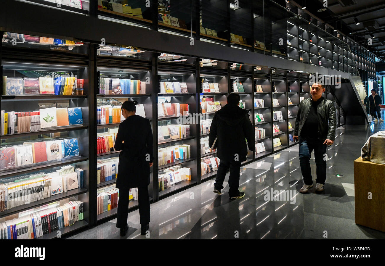 Books are on display on the giant book shelf, which spans 240 meters ...