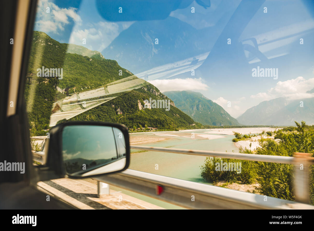 view from car window of mountains with river background road trip Stock ...
