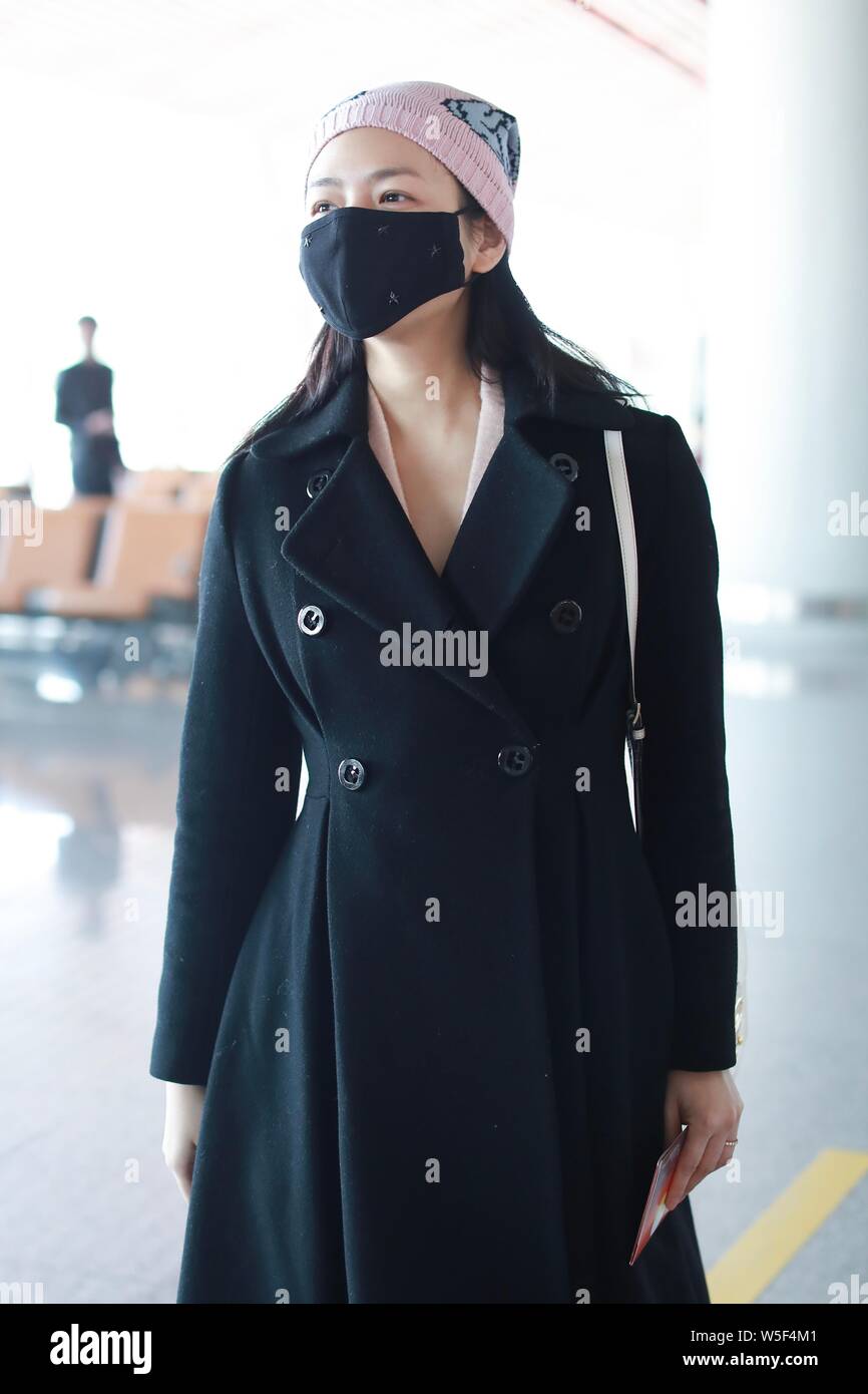 Taiwanese actress Michelle Chen wearing a face mask arrives at the Beijing Capital International ...