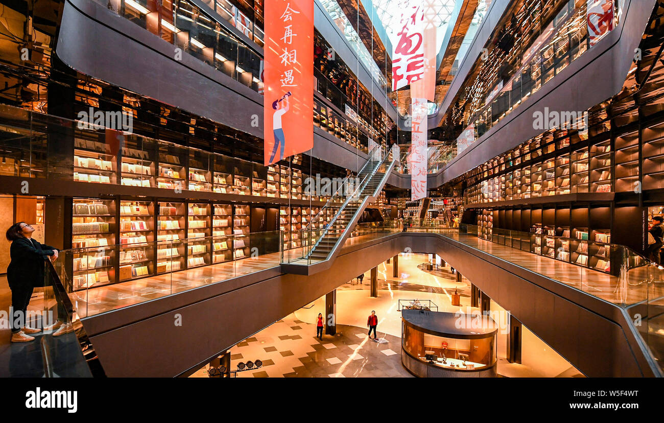 Books are on display on the giant book shelf, which spans 240 meters ...