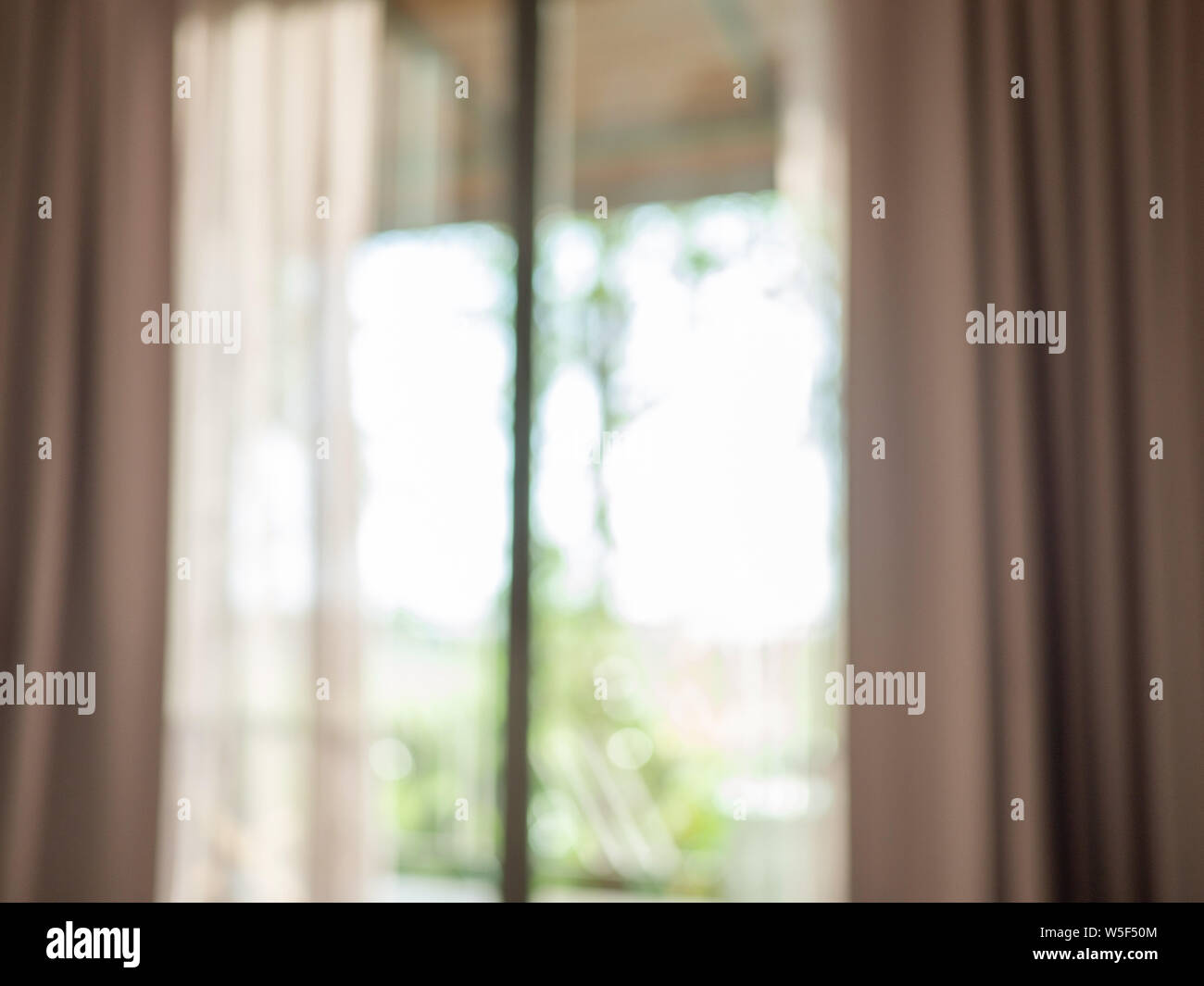 Blurred window with curtains and sunlight Stock Photo - Alamy