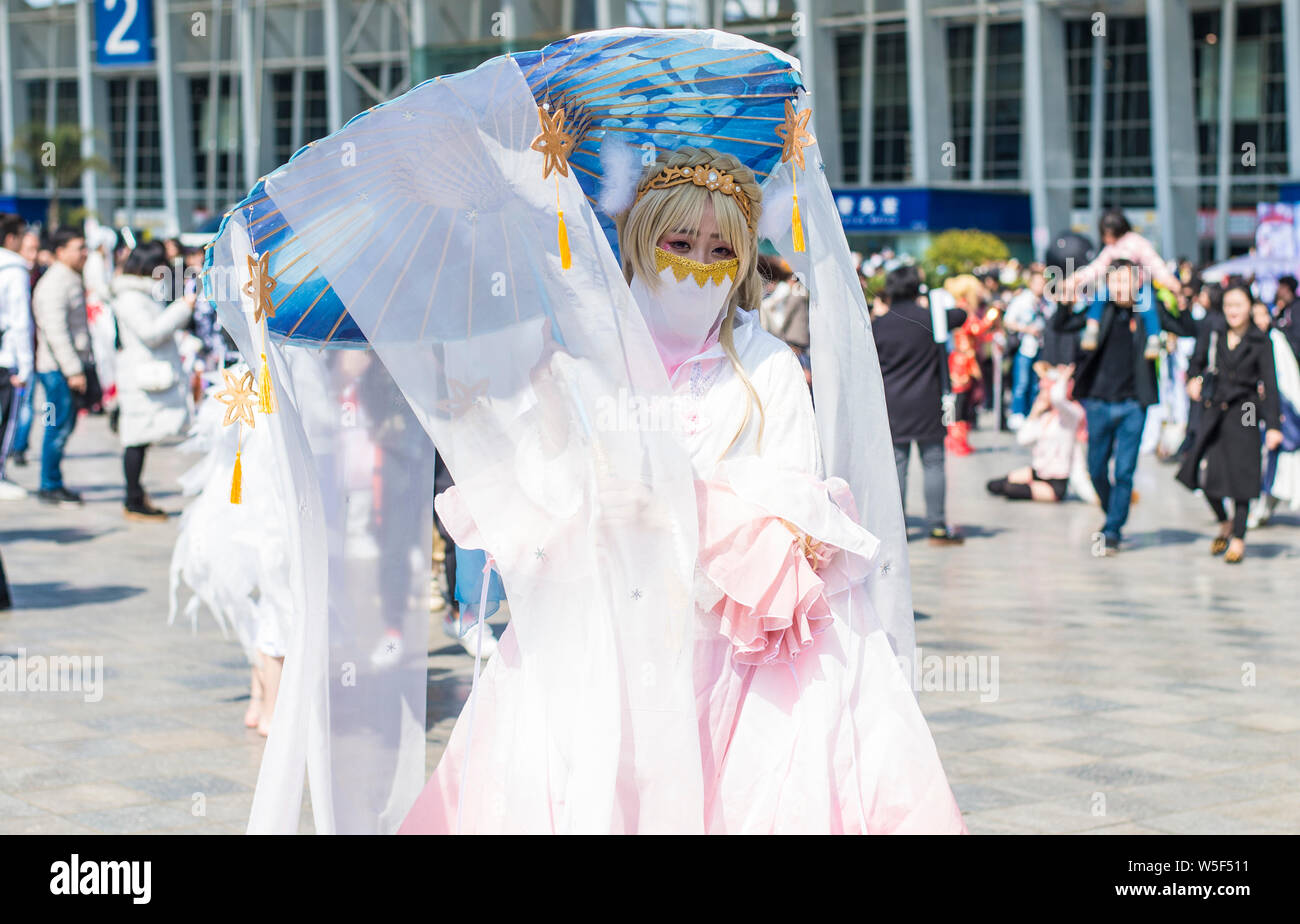 A Chinese coser dressed in cosplay costumes poses during the 23rd ...
