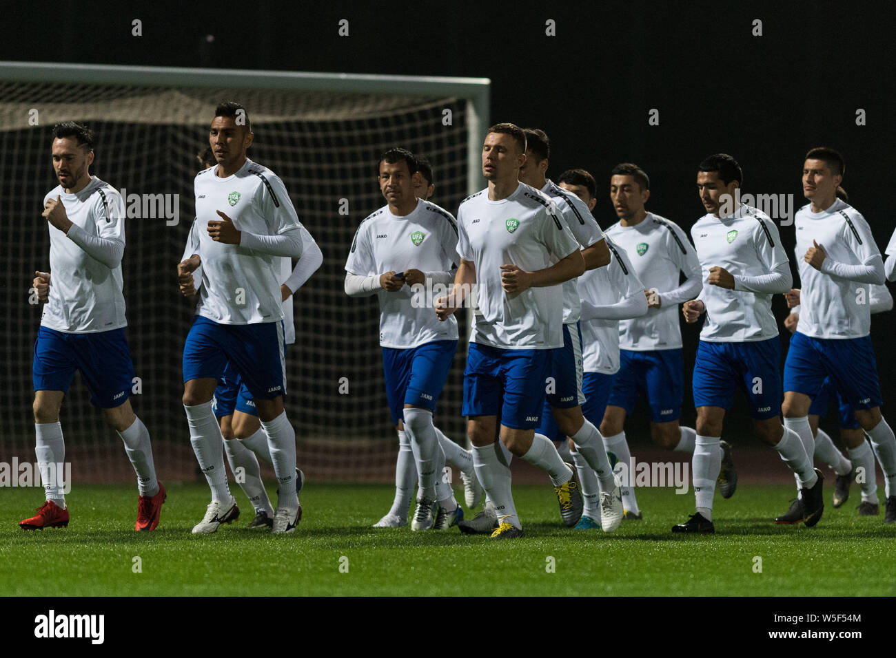 Players of Uzbekistan national men's football team take part in a ...