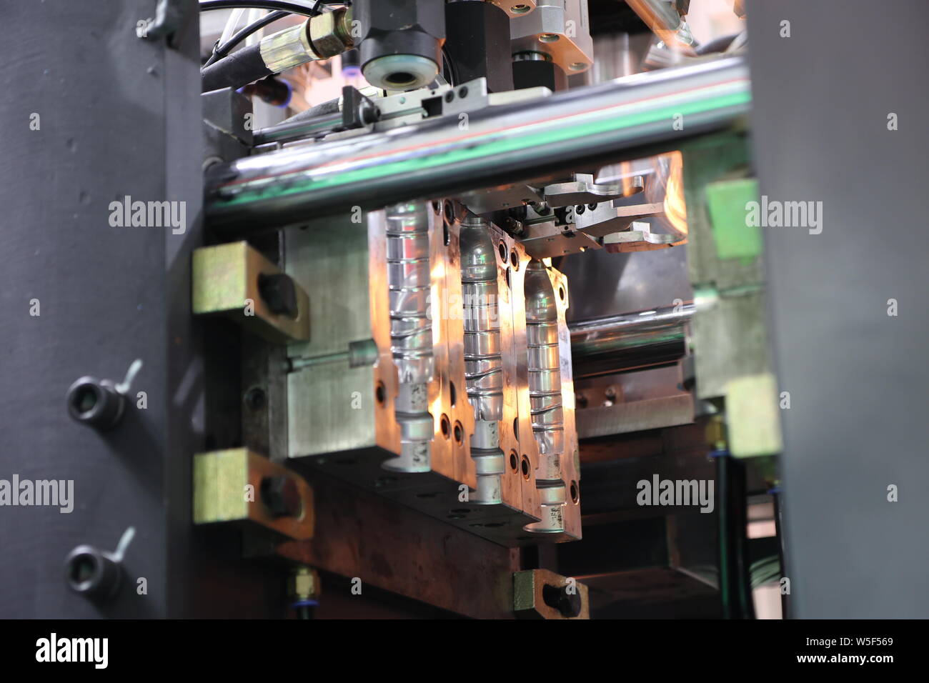 Plastic bottle injection mould set in machine ; preparing for ...