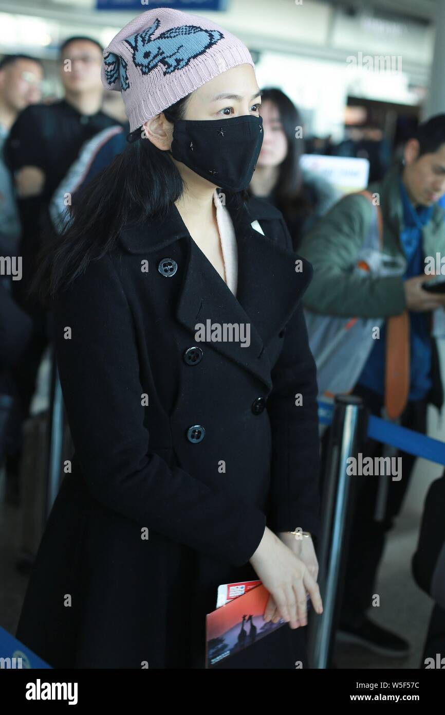 Taiwanese actress Michelle Chen wearing a face mask arrives at the Beijing Capital International ...
