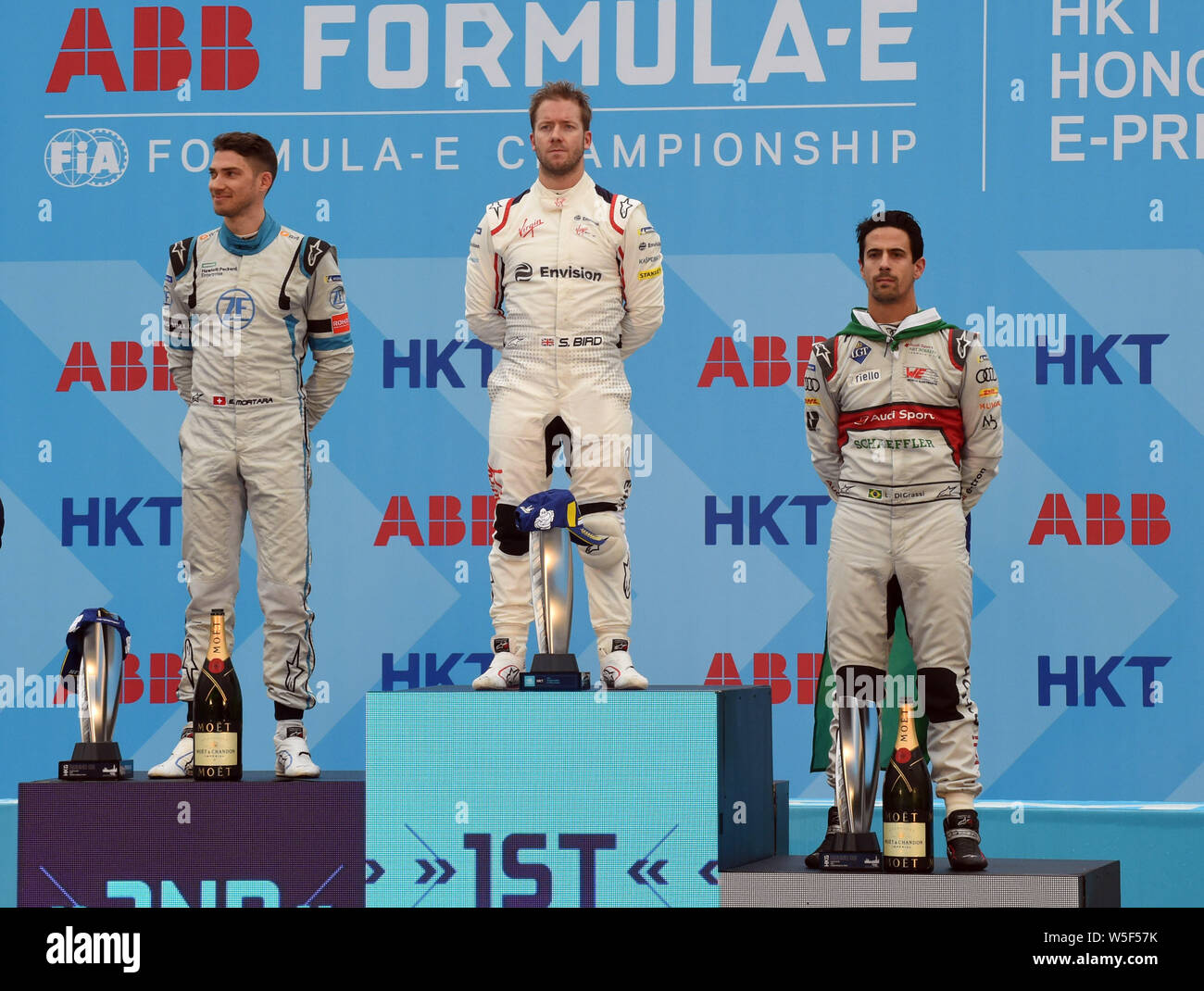 British racing driver Sam Bird, center, poses during the award ...