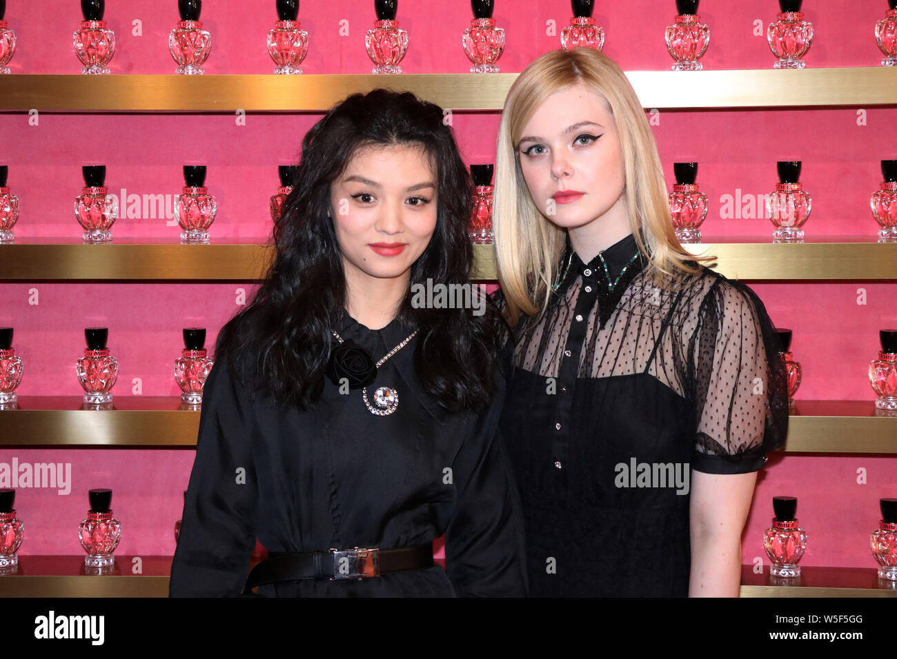 American actress and fashion model Elle Fanning, right, and Chinese ...