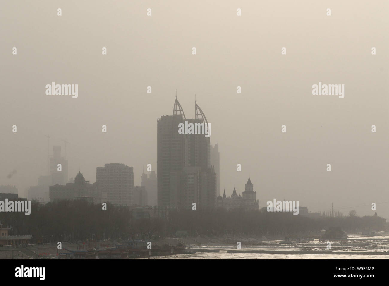 Cityscape of Harbin in heavy smog and a sandstorm in Harbin city ...