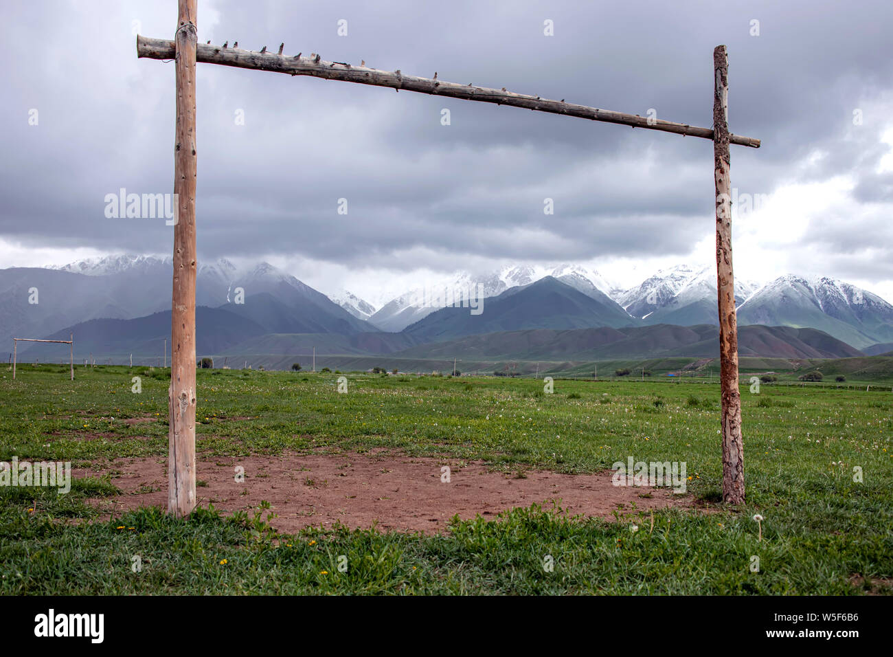 Rustic field with a wooden gate for playing football on the background ...