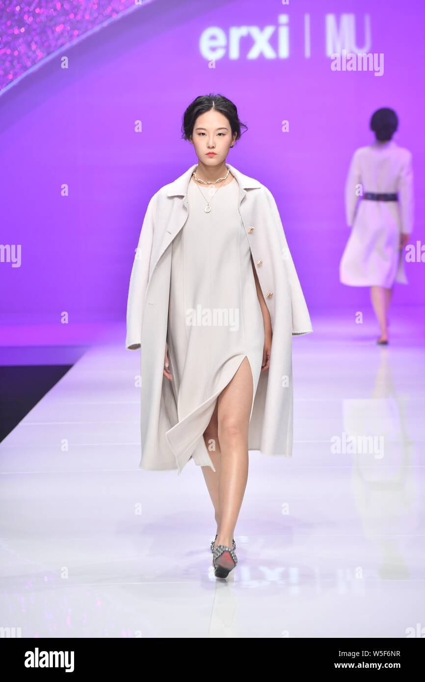 A model displays a new creation at the fashion show of City Fashion ...