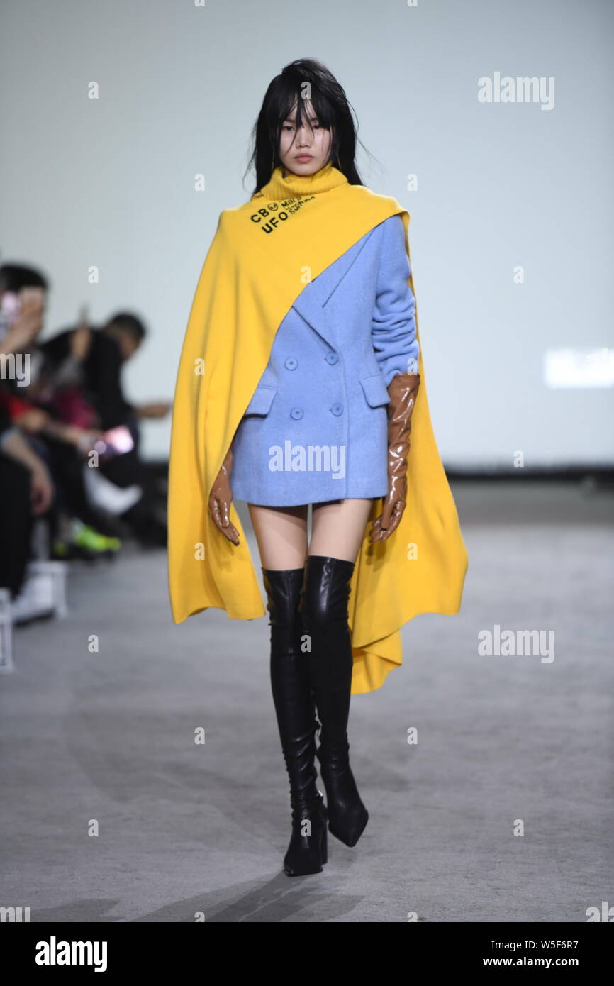 A model displays a new creation at the fashion show of Chris by ...