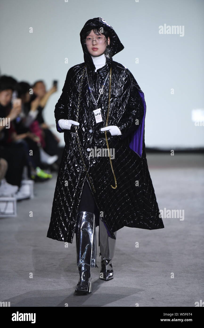 A model displays a new creation at the fashion show of Chris by ...