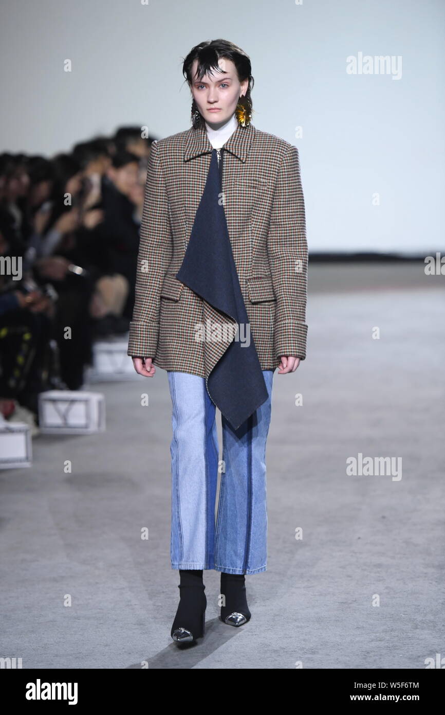 A model displays a new creation at the fashion show of Chris by ...