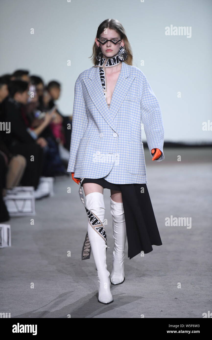 A model displays a new creation at the fashion show of Chris by ...