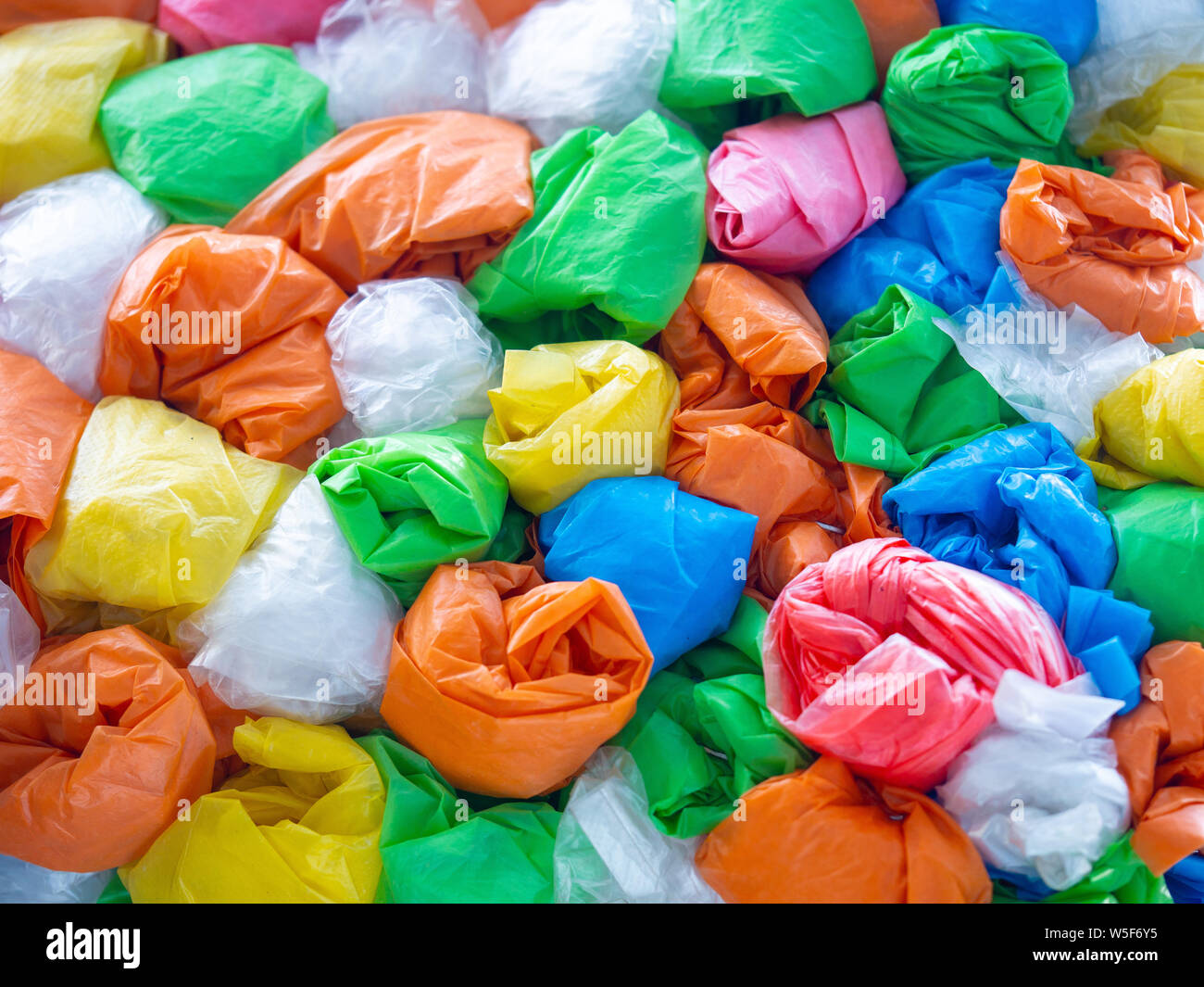 Multi color plastic bag background Stock Photo - Alamy