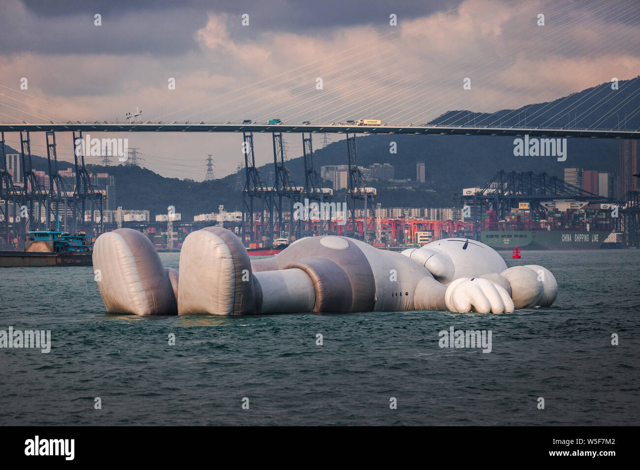 The 37-metre-long floating sculpture by US artist Kaws is placed at the ...