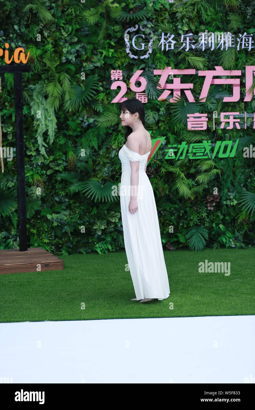 Singer Li Yitong of Chinese idol group SNH48 poses as she arrives for ...