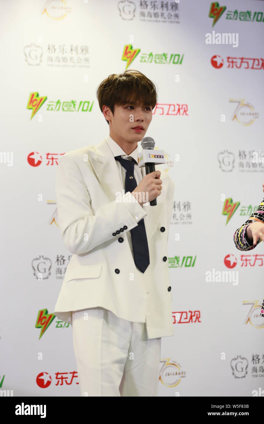 Lin Yanjun of Chinese boy group Nine Percent poses with his trophys ...