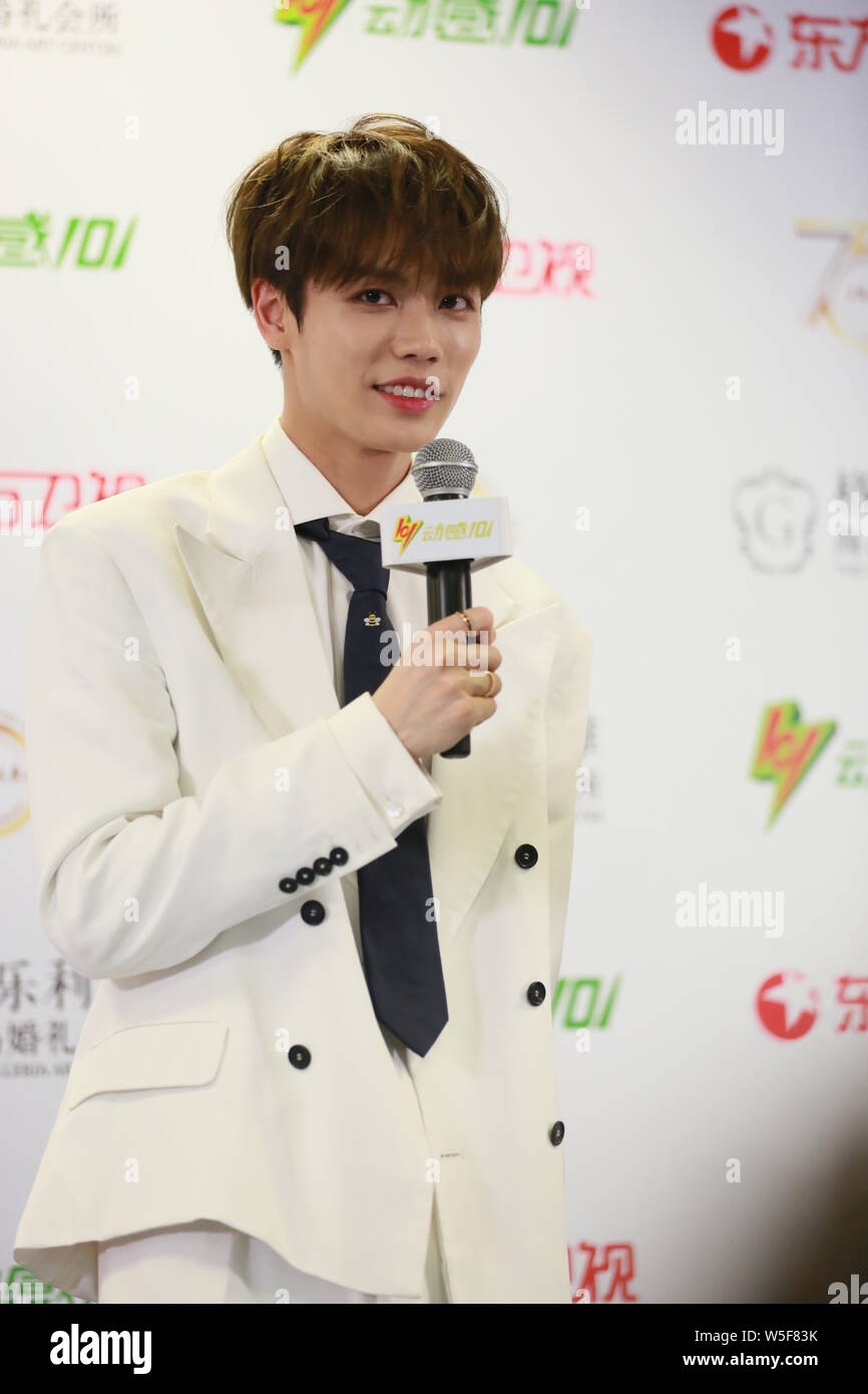 Lin Yanjun of Chinese boy group Nine Percent poses with his trophys ...