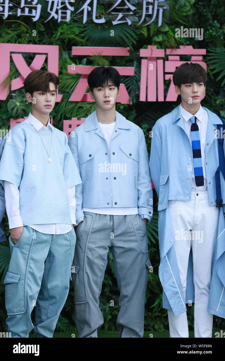 Chinese singer Fan Chengcheng, center, the younger brother of actress ...