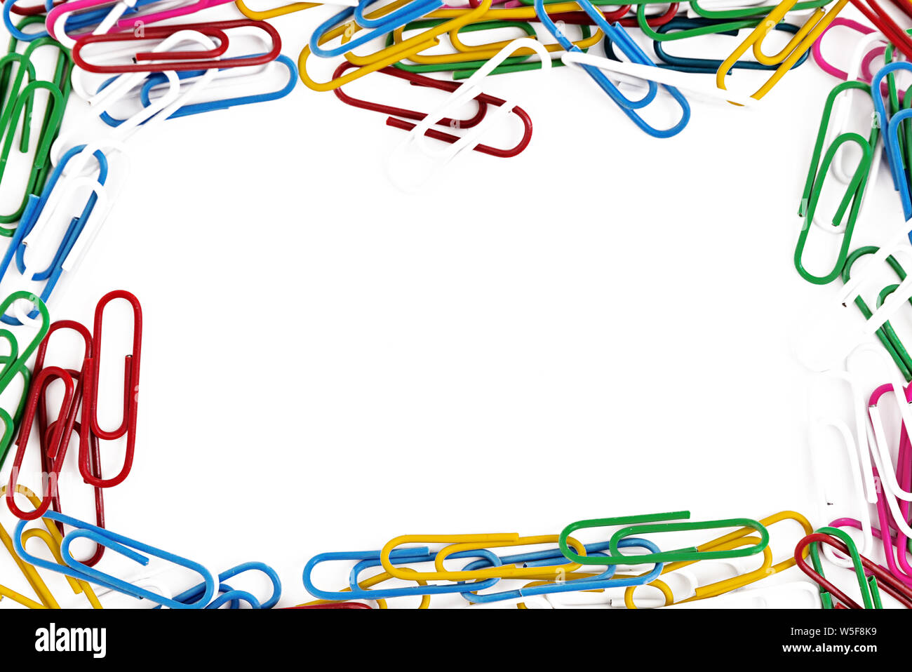 Colored paper clips isolated on white background Stock Photo - Alamy