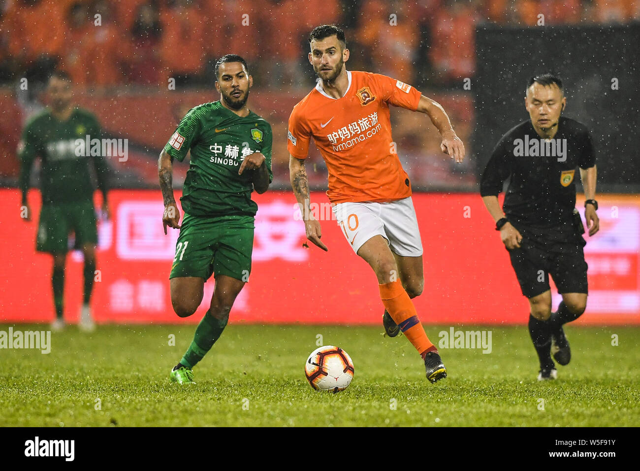 Spanish football player Jonathan Viera, left, of Beijing Sinobo Guoan F ...