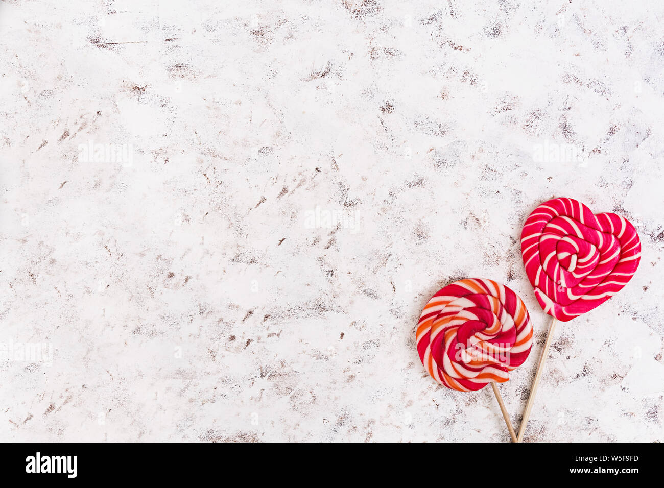 Colorful lollipops on white background. Top view Stock Photo - Alamy