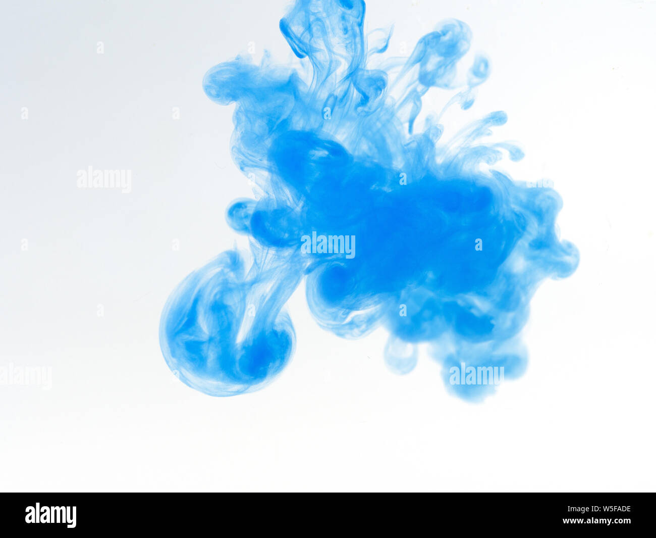 Poster color in water. Abstract background Stock Photo - Alamy
