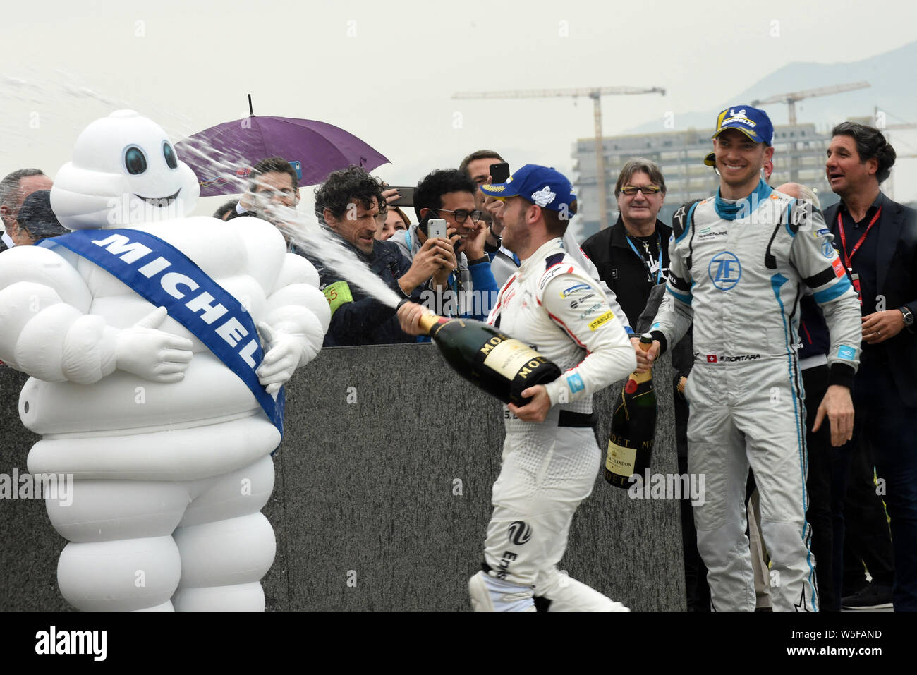 British racing driver Sam Bird sprays champagne to celebrate during the ...