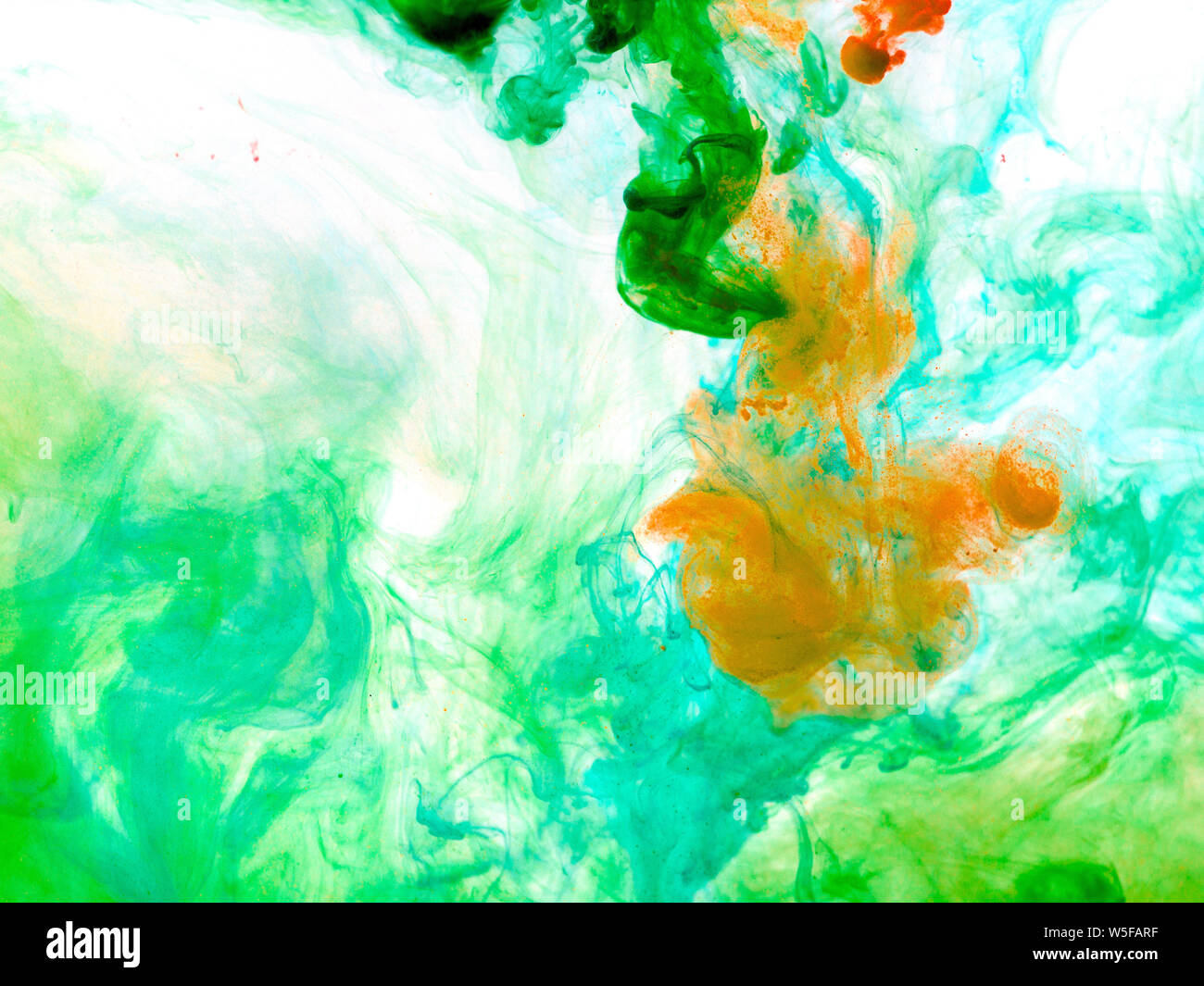 Poster color in water. Abstract background Stock Photo - Alamy