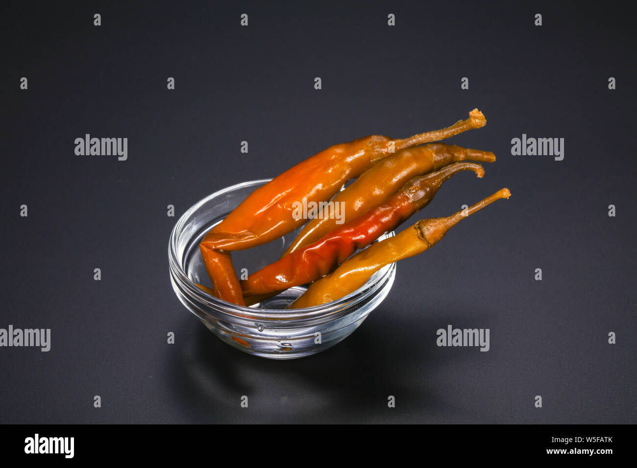 Marinated chilli pepper heap in the bowl Stock Photo - Alamy