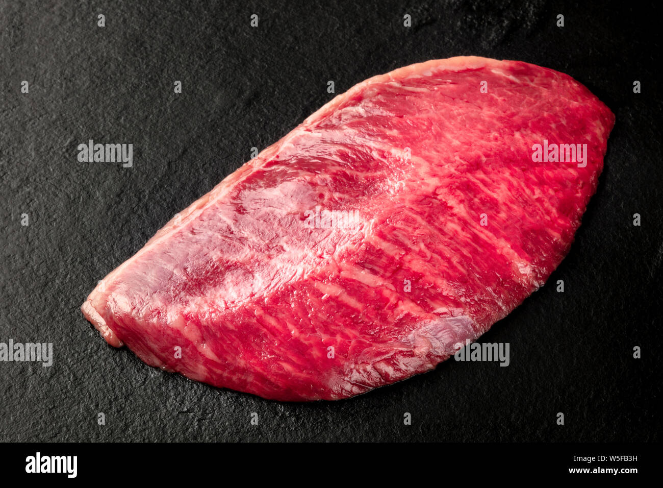 Kobe meat, wagyu beef steak, raw, on a black background Stock Photo - Alamy