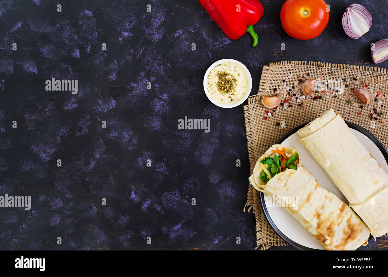 Shawarma sandwich with ingredients on dark background. Top view Stock ...