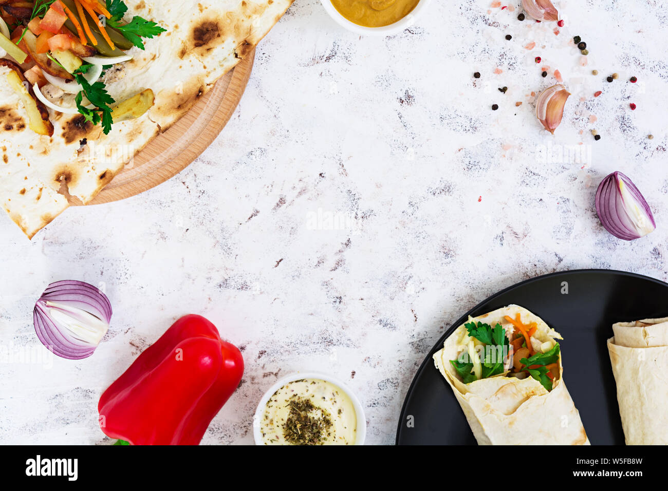 Shawarma sandwich with ingredients on white background. Top view Stock ...