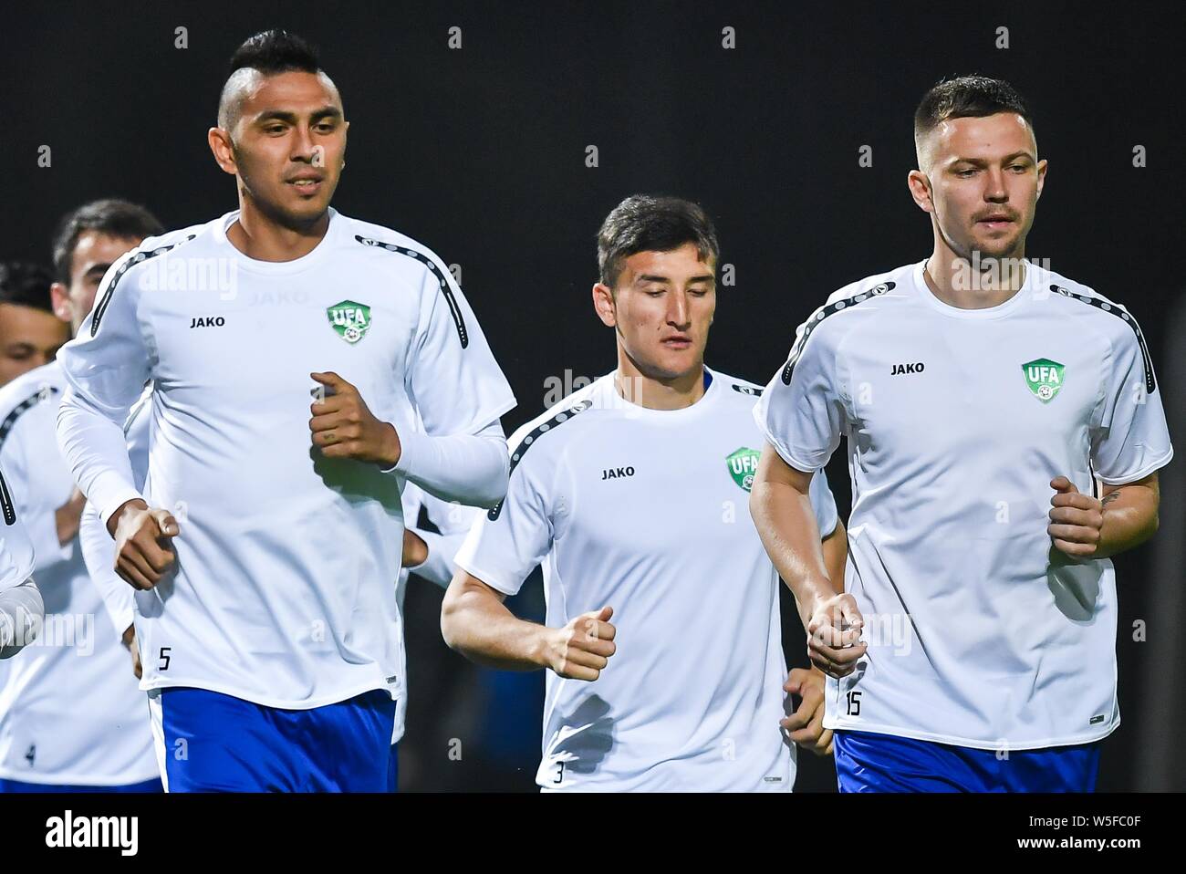 Players of Uzbekistan national men's football team take part in a ...