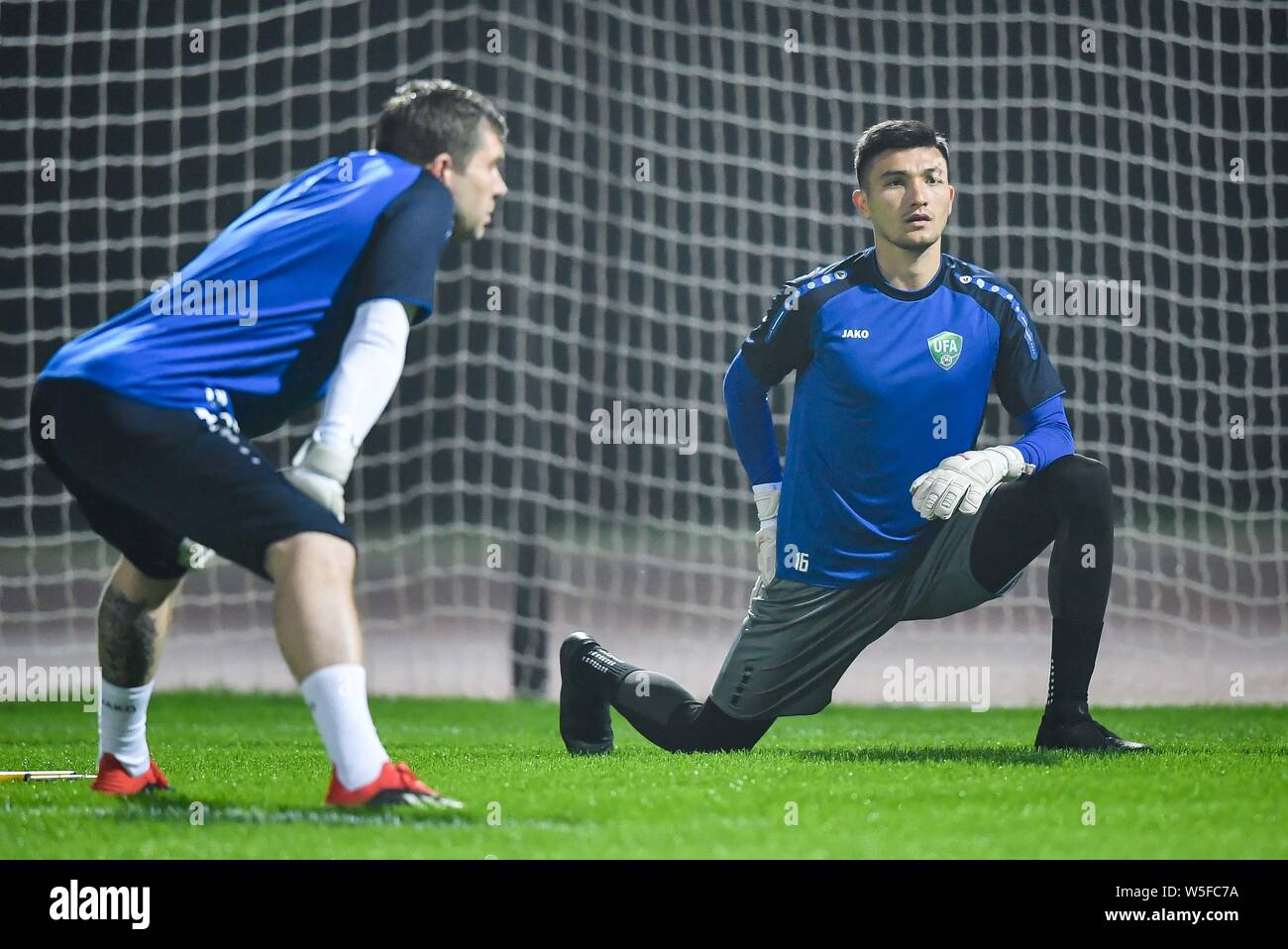 Players of Uzbekistan national men's football team take part in a ...