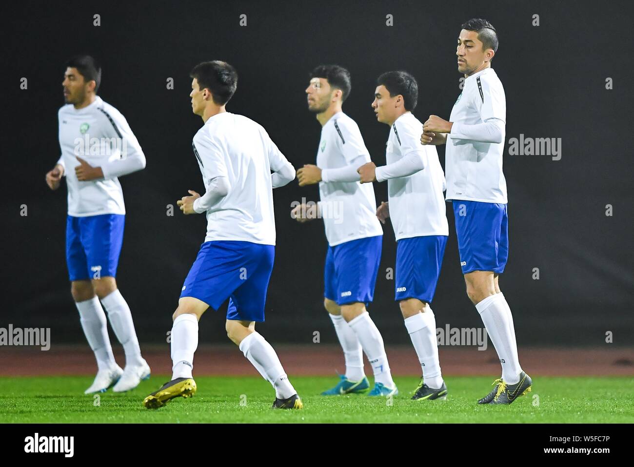 Players of Uzbekistan national men's football team take part in a ...