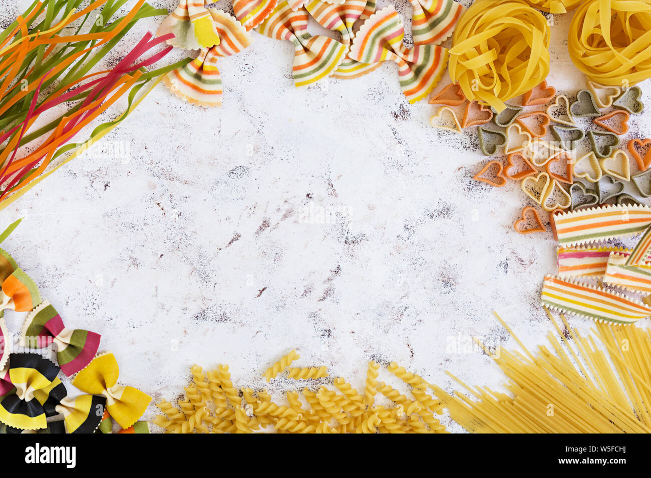 Dry pasta background. Different pasta on white background. Flat lay ...