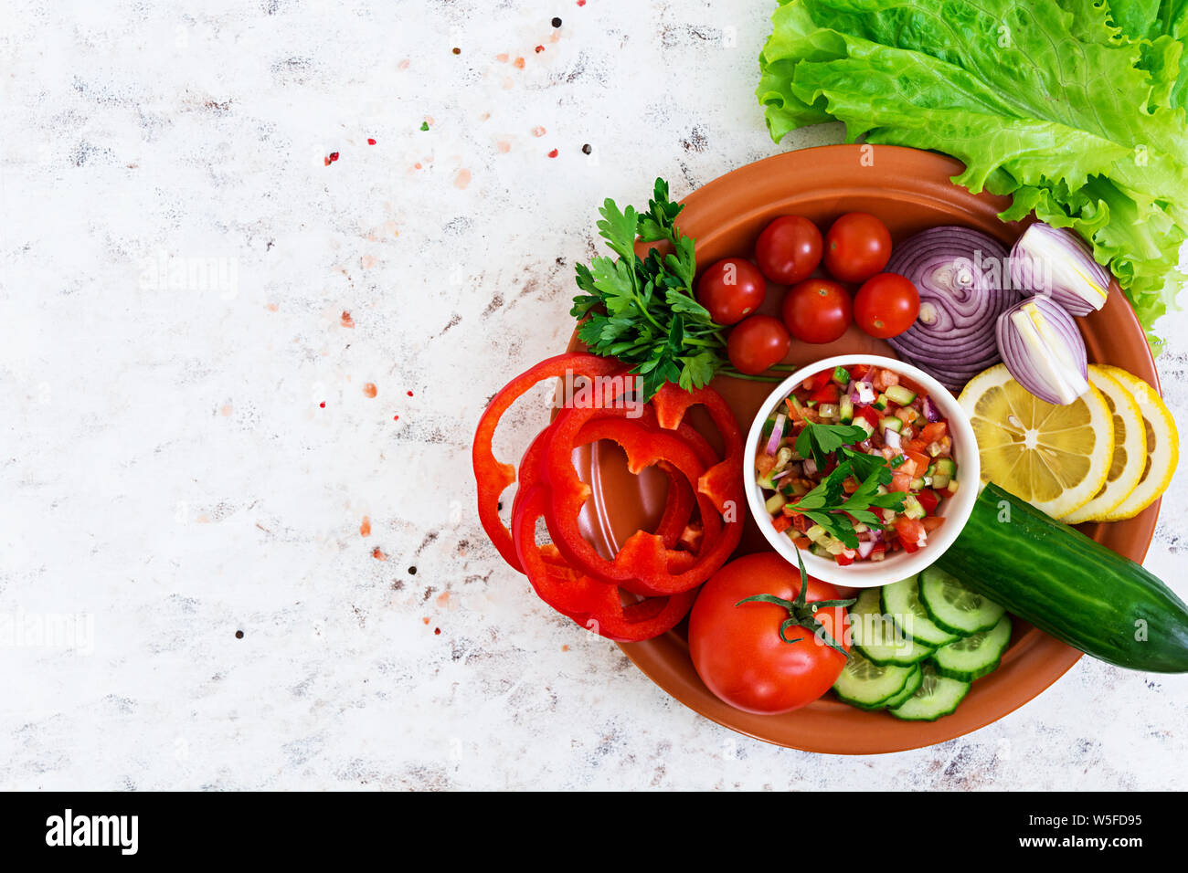 Salsa with ingredients on white background. Top view Stock Photo - Alamy