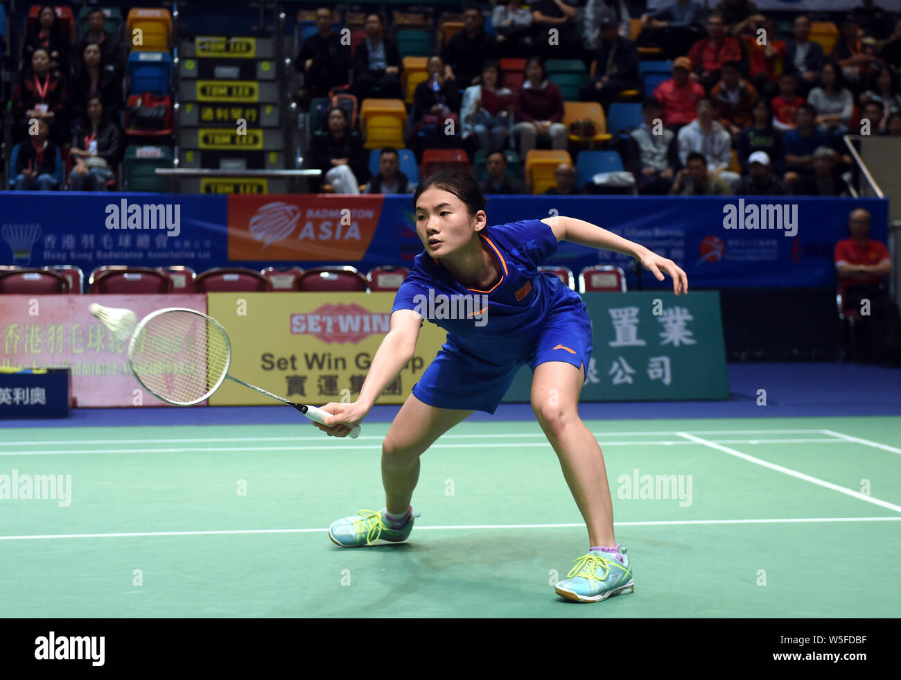 Han Yue of China returns a shot to Sayaka Takahashi of Japan during the ...