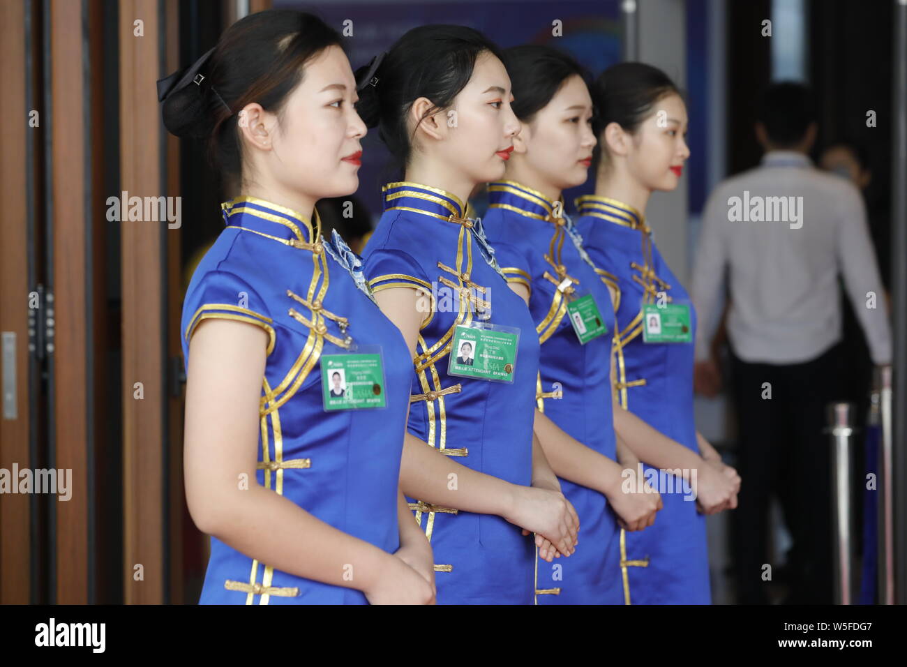 Chinese hostesses pose at the BFA International Convention Center ahead ...