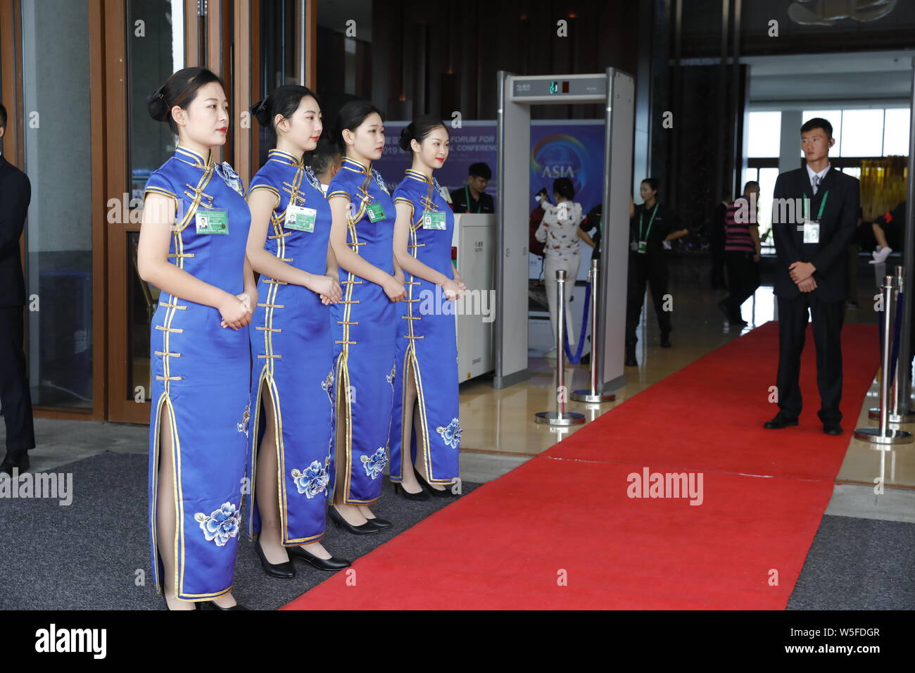 Chinese hostesses pose at the BFA International Convention Center ahead ...