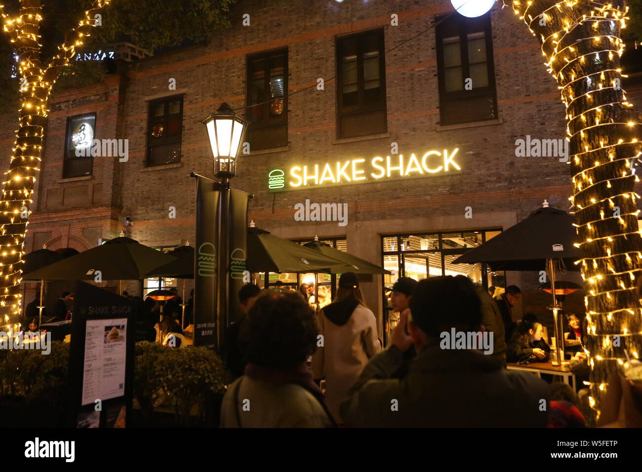 Chinese customers queue up outside the first Mainland China Shake Shack ...