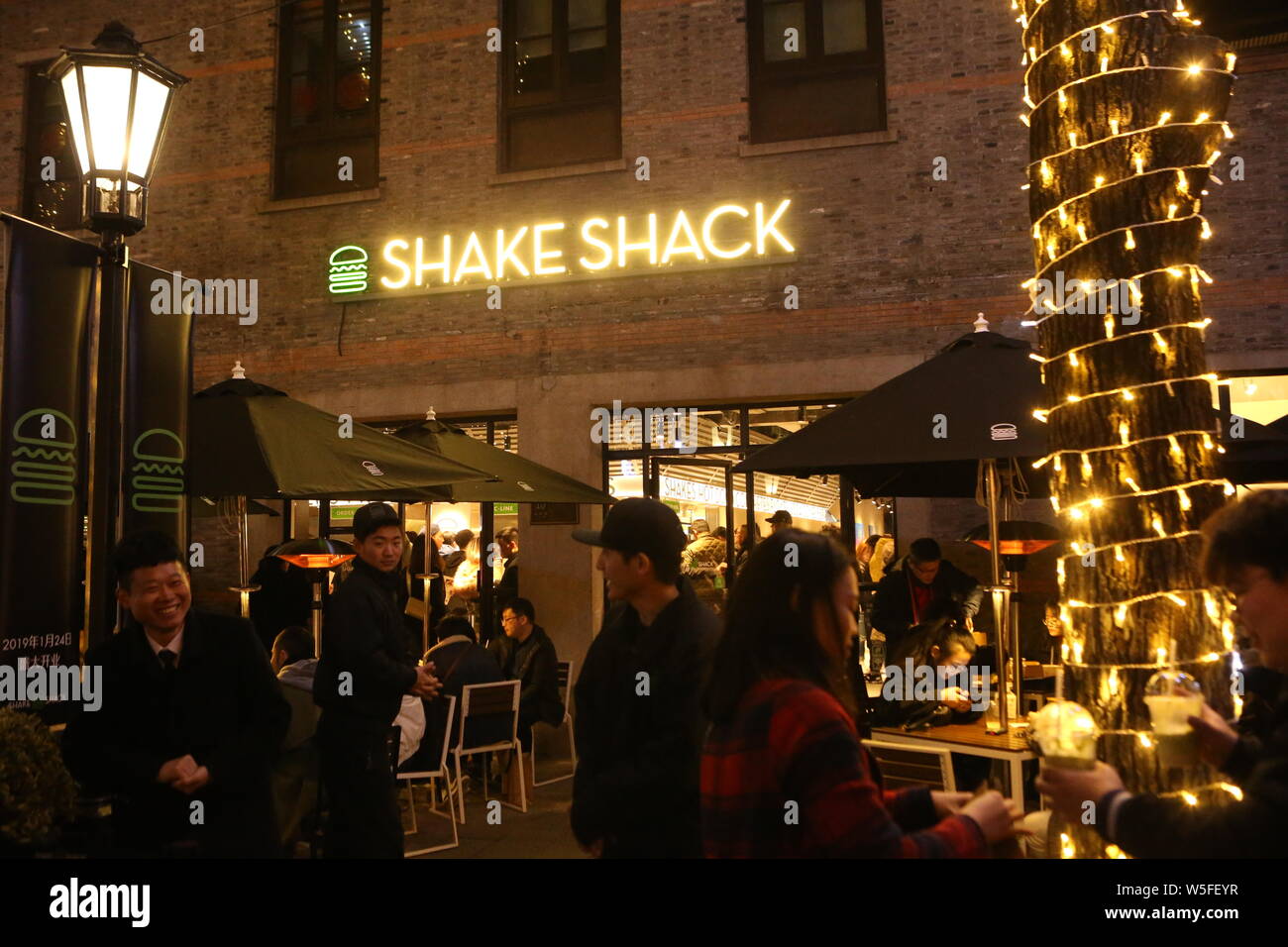 Chinese customers queue up outside the first Mainland China Shake Shack ...