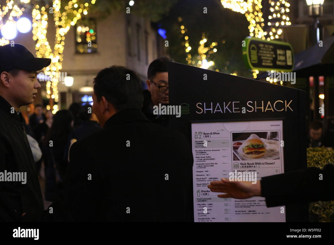 Chinese customers queue up outside the first Mainland China Shake Shack ...