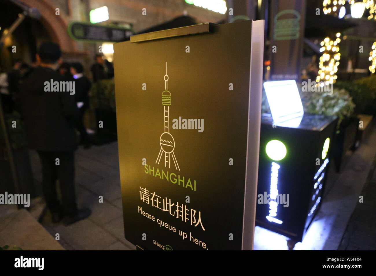 Chinese customers queue up outside the first Mainland China Shake Shack ...
