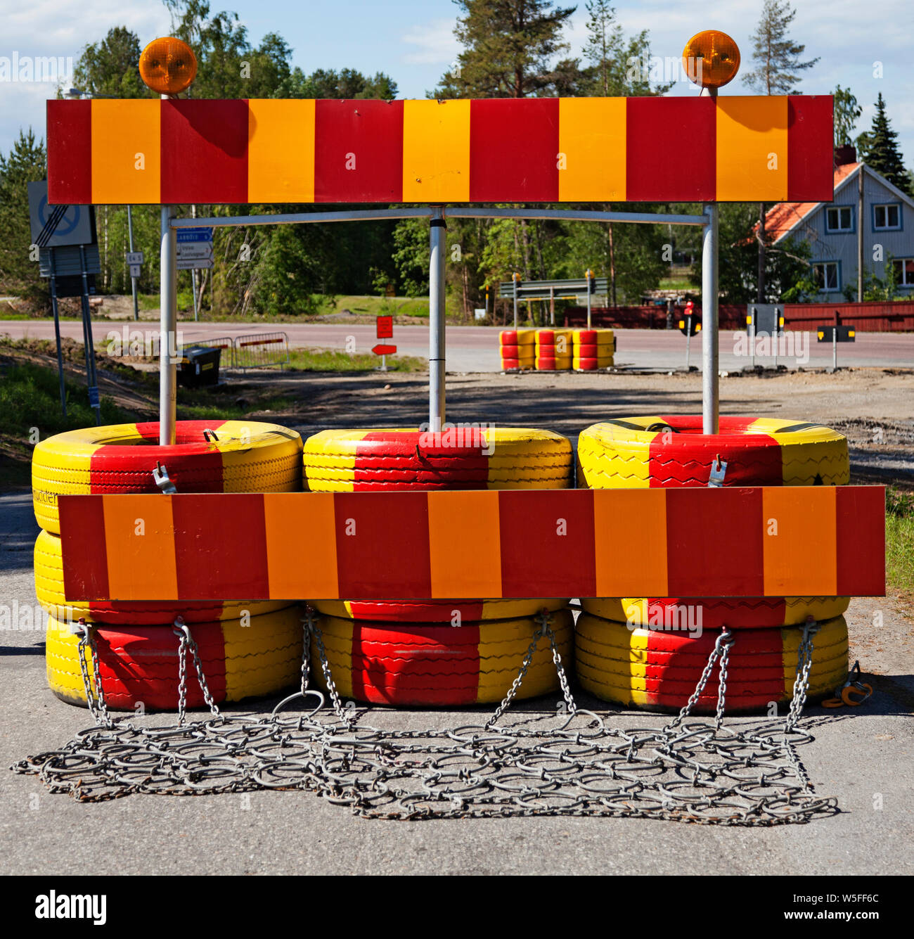 warning sign and stop at road construction Stock Photo - Alamy
