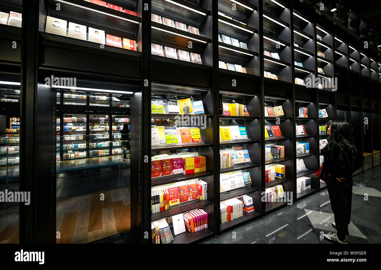 Books are on display on the giant book shelf, which spans 240 meters ...