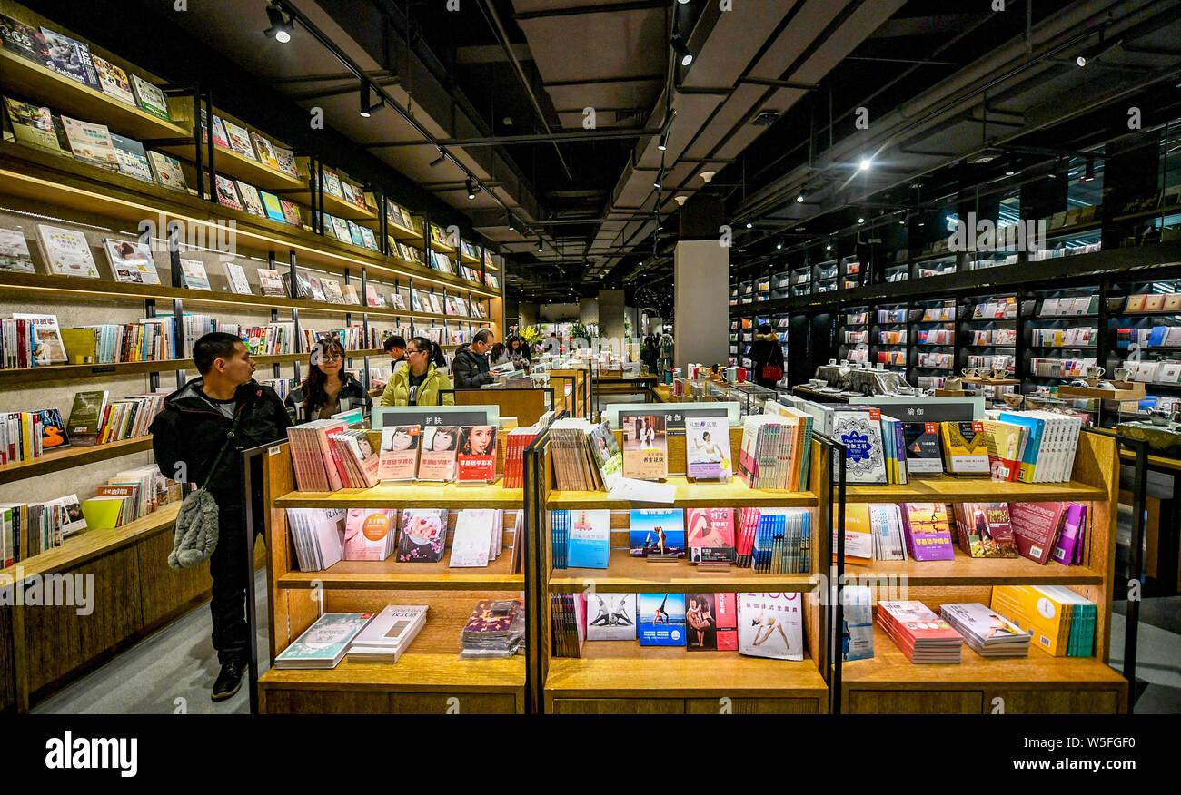 Books are on display on the giant book shelf, which spans 240 meters ...